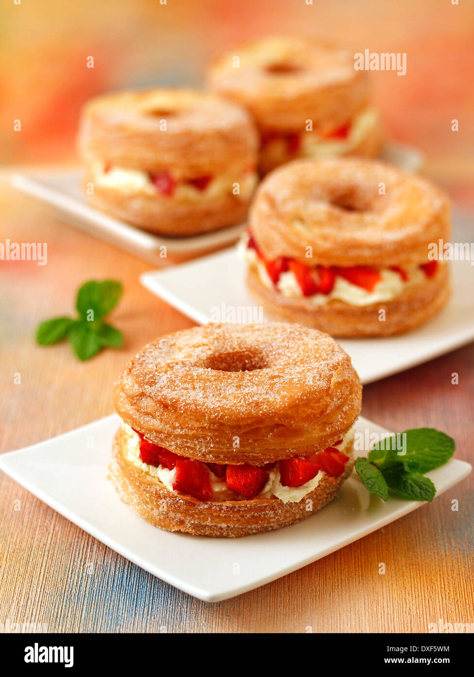 Cronuts with strawberries and mascarpone. Recipe available Stock Photo ...