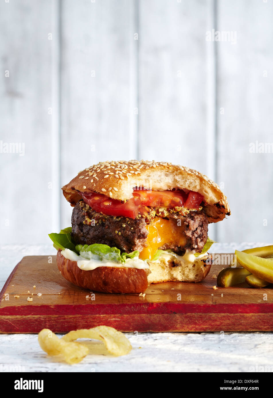 Cheese Filled Hamburger with Bites Taken, Studio Shot Stock Photo - Alamy
