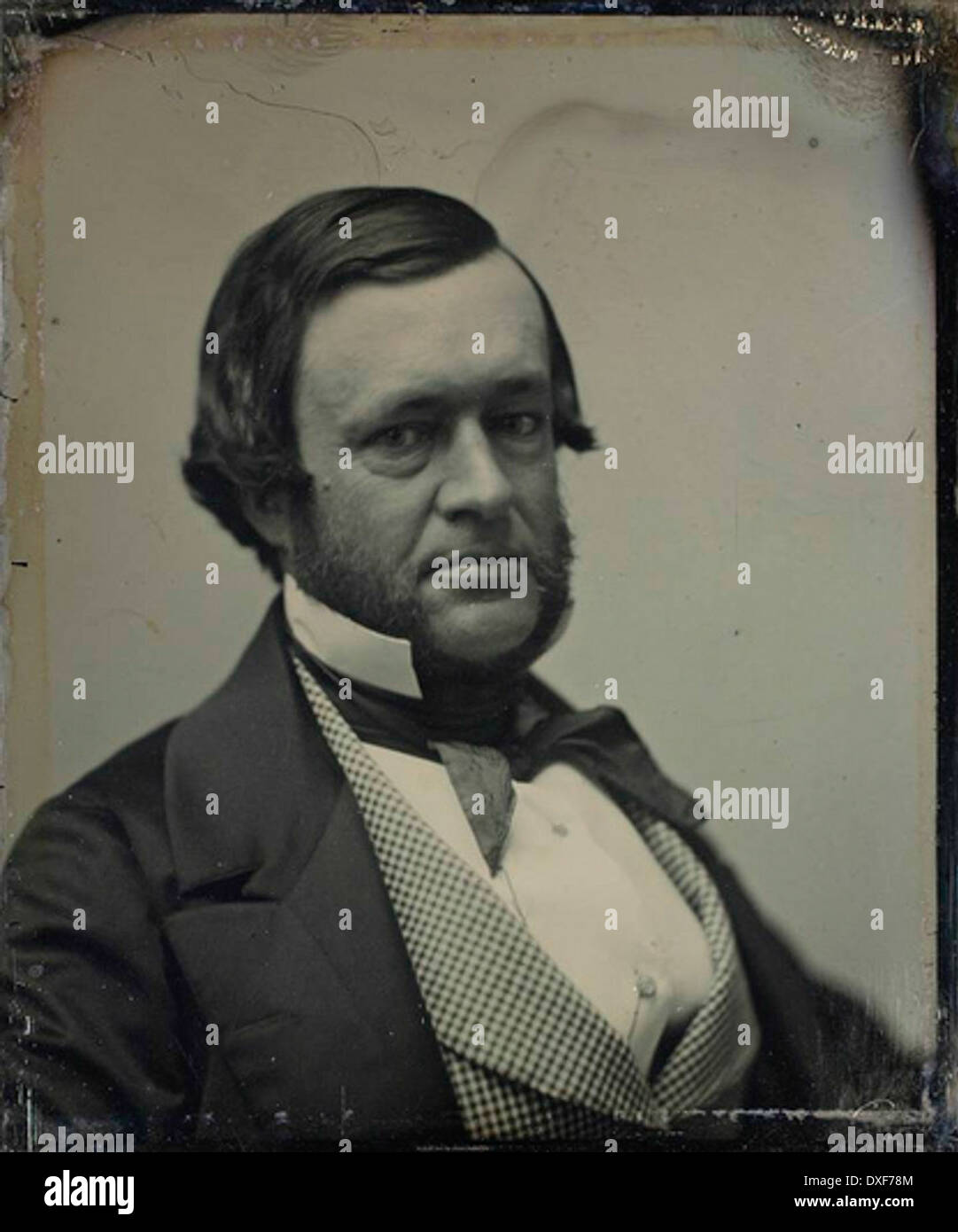 This vintage photograph features an unidentified man, offering a ...