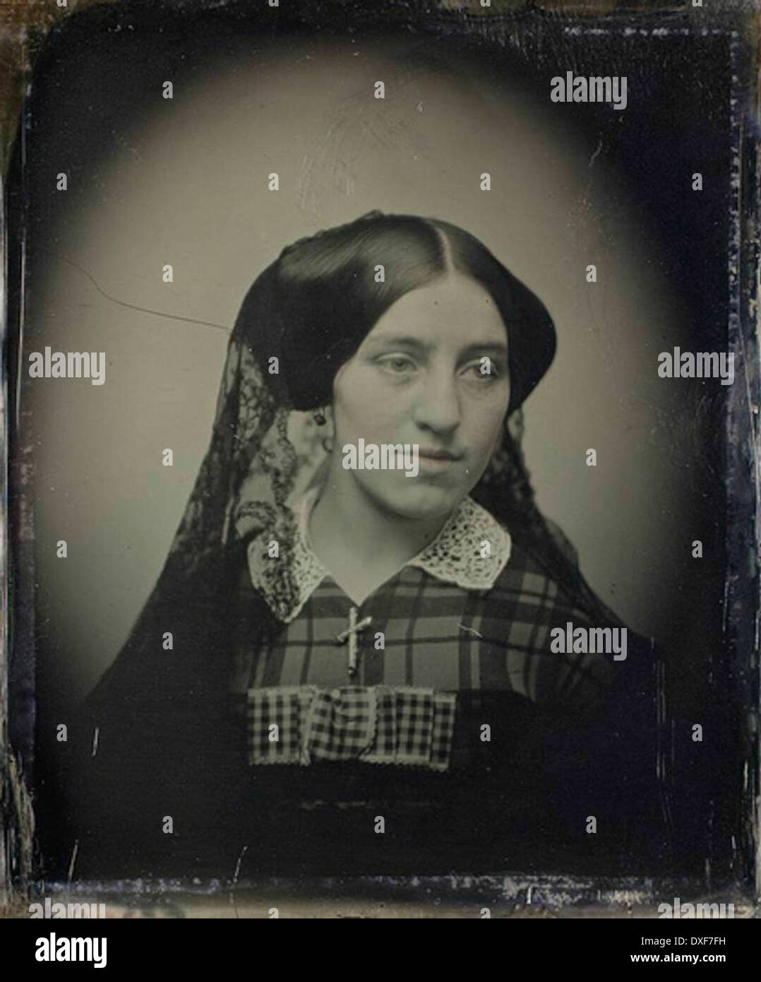 This vintage photograph features an unidentified woman from a bygone ...