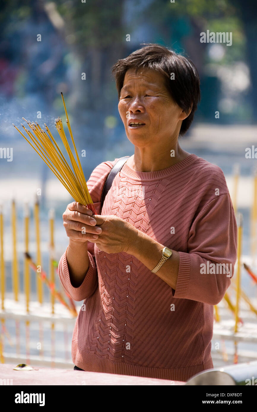 Worship at a Taoist temple on the island of Lantau in Hong Kong. Taoism ...