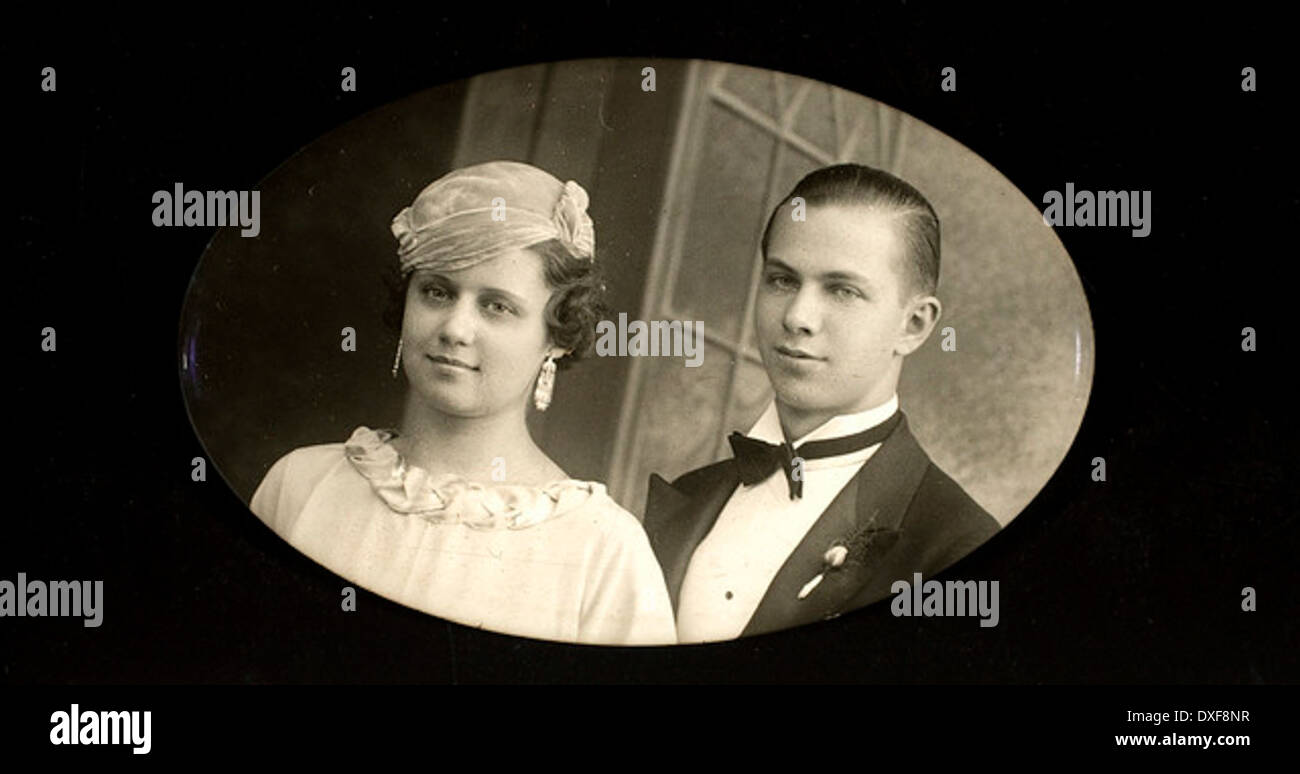 This vintage photograph shows a bride and groom, capturing a moment ...