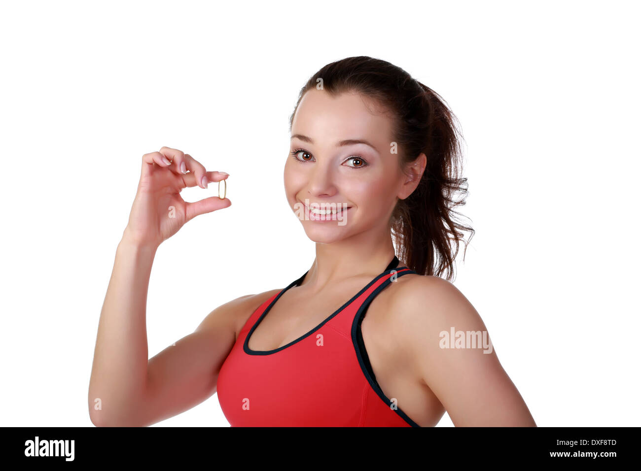 Female fitness model with Omega-3 acid pills Stock Photo - Alamy