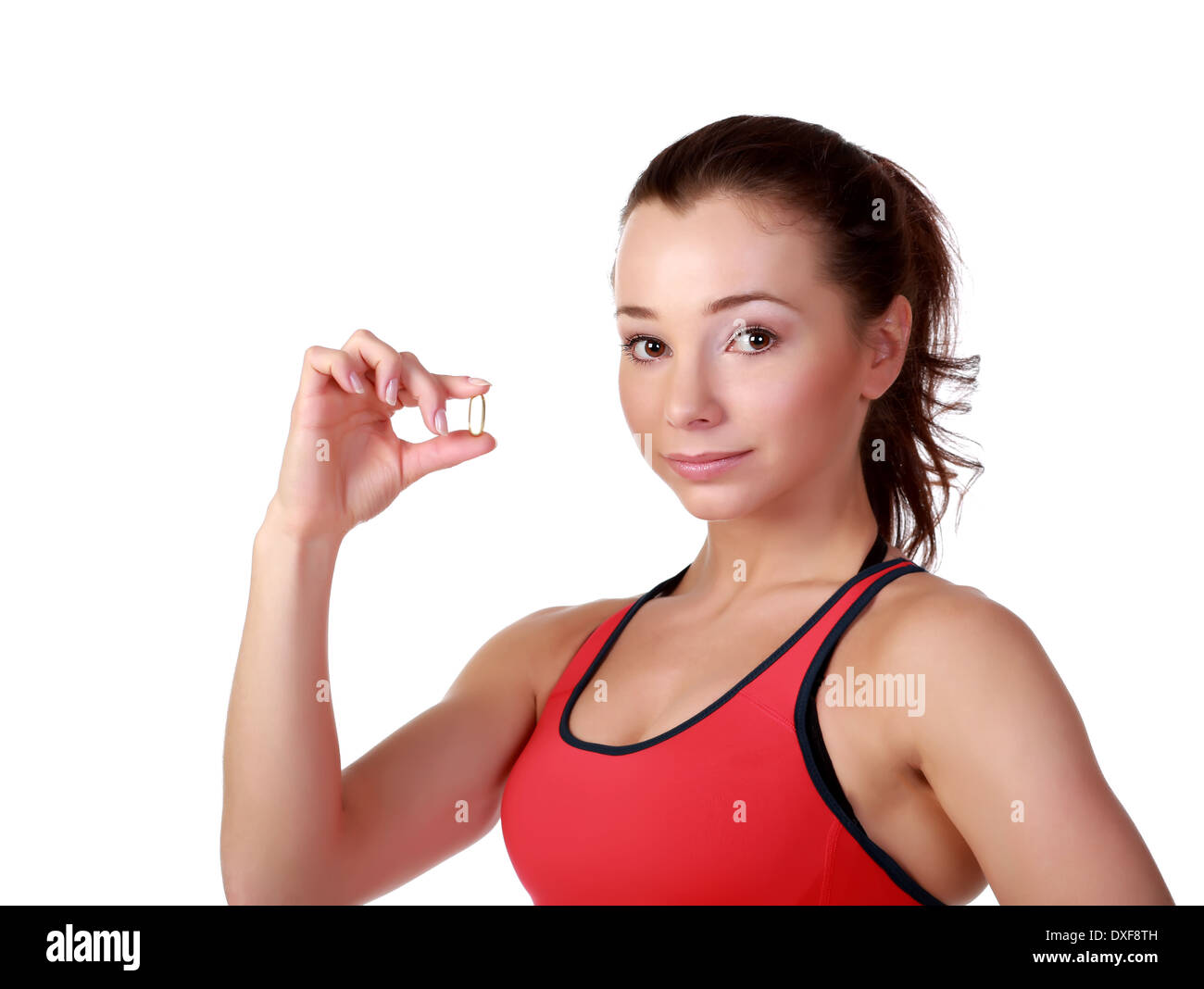 Female fitness model with Omega-3 acid pills Stock Photo - Alamy