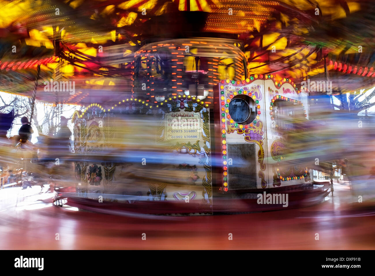 A carousel in motion Stock Photo - Alamy