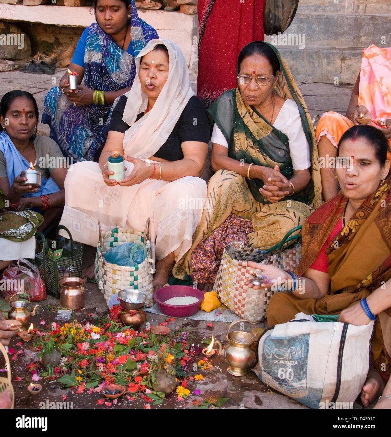 Group of Hindu women at prayer on the Hindu ghats on the banks of the ...