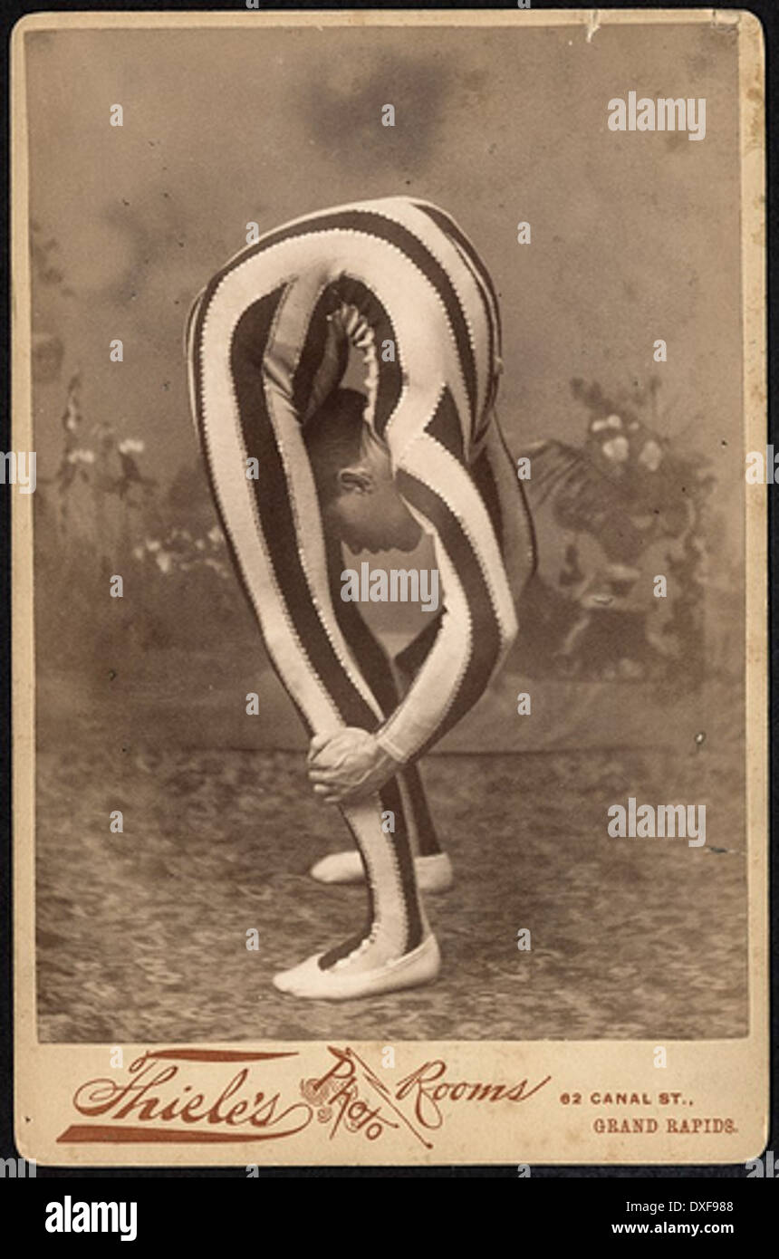 This vintage photo shows a contortionist posed in a studio, showcasing ...