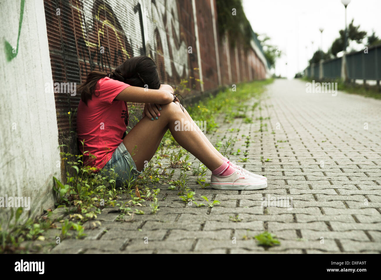 Crouch sitting head down hi-res stock photography and images - Alamy