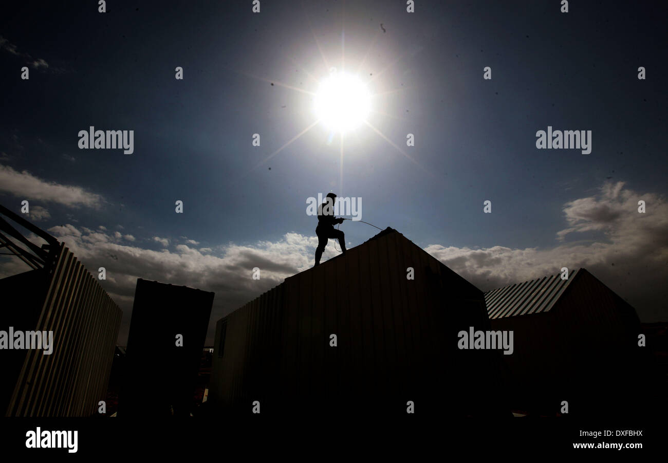 Amman, Jordan. 25th Mar, 2014. A Jordanian worker constructs steel ...