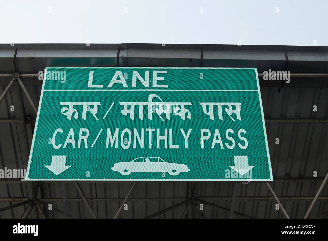 A Notice board showing a lane for car with monthly pass vehicles at a ...