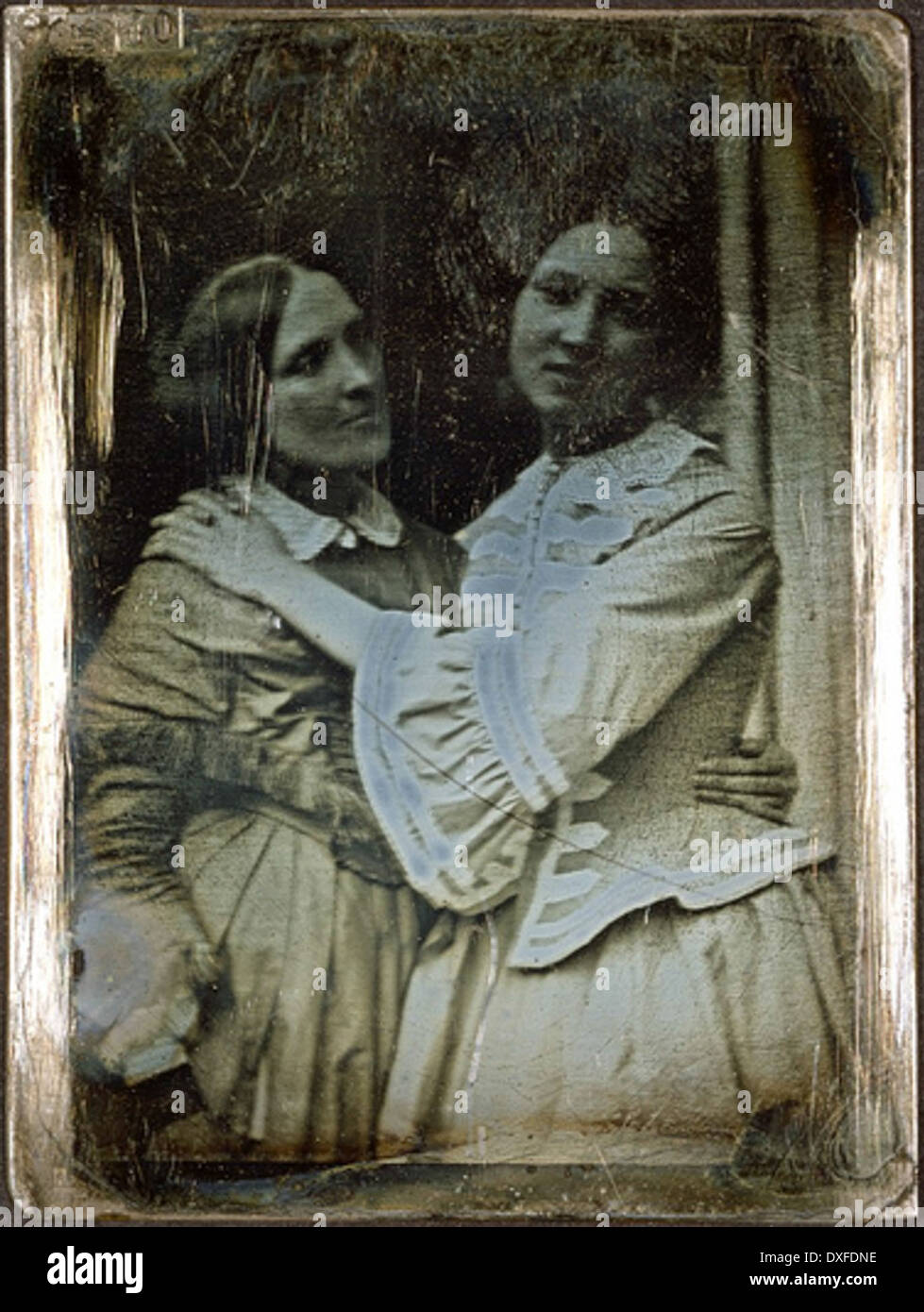This vintage photograph shows two women from a bygone era, highlighting ...