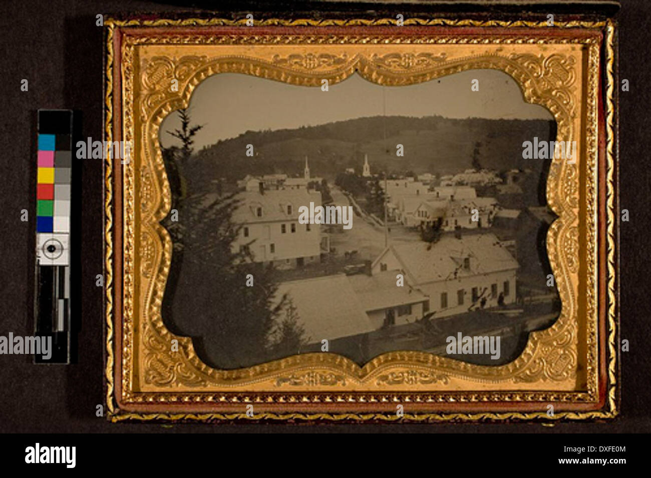 This photograph captures an unidentified townscape viewed from a high ...