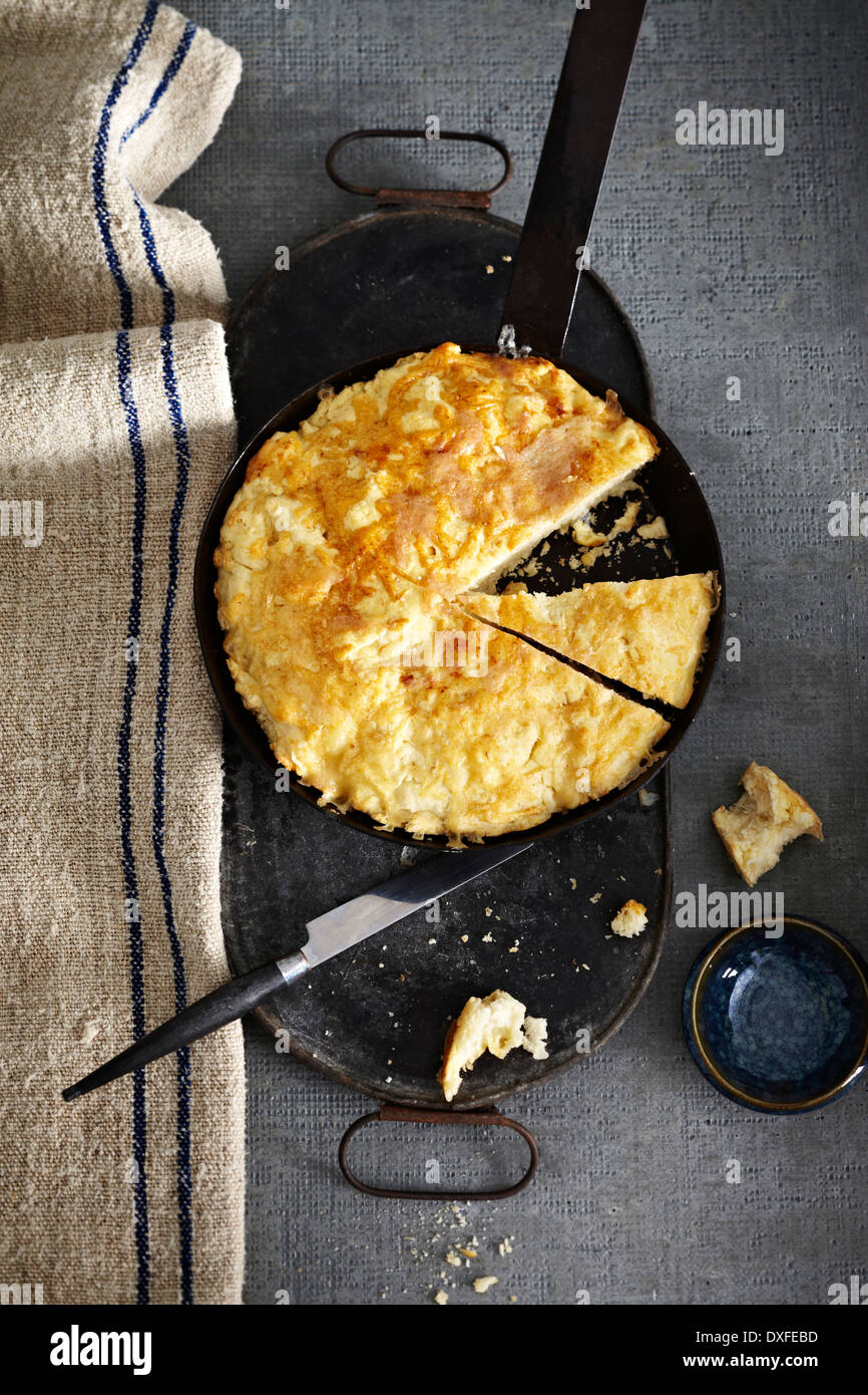 Cheesy Bannock bread in baking pan on grey background, studio shot ...