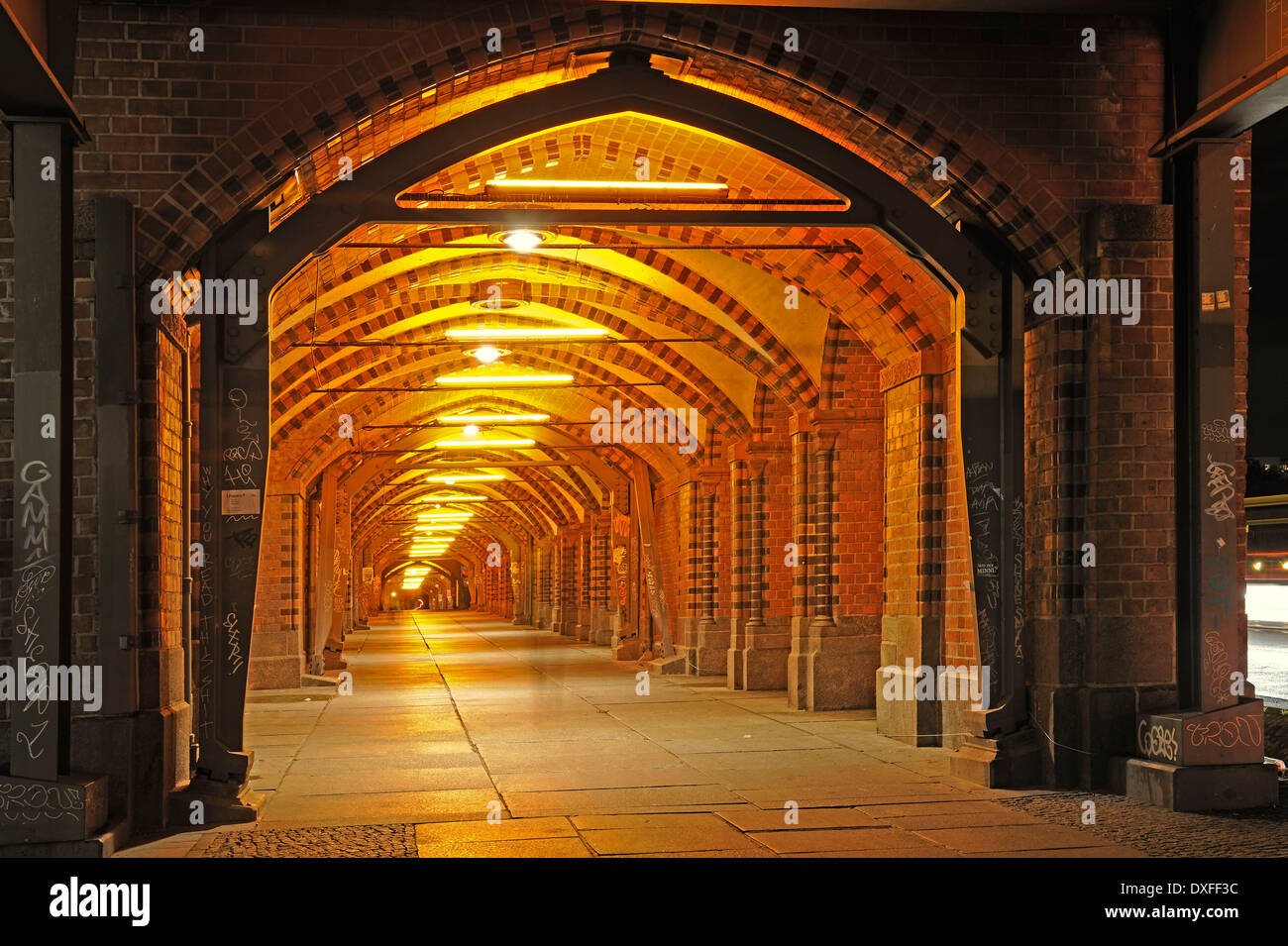 Illuminated colonnades Oberbaumbrucke bridge over river Spree during ...