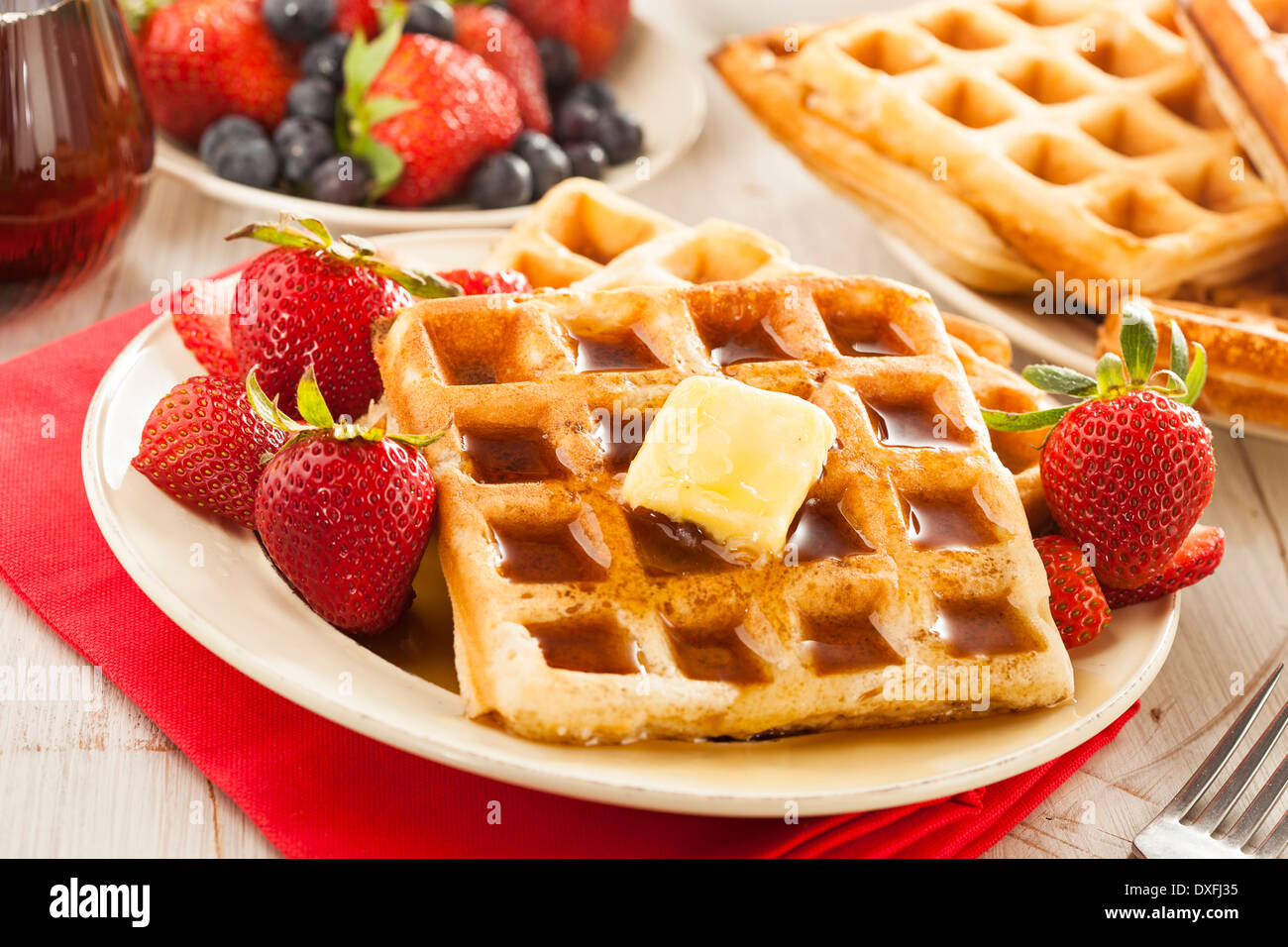 Homemade Belgian Waffles with Strawberries and Maple Syrup Stock Photo ...