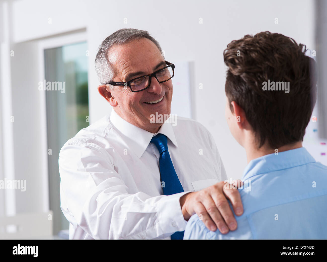 Old man hand on shoulder hi-res stock photography and images - Alamy