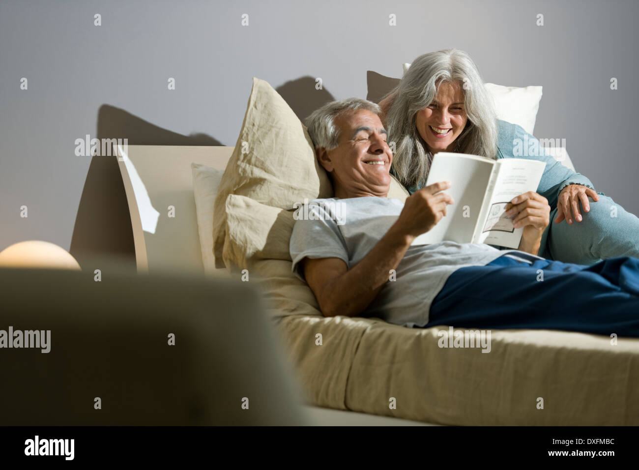 Mature couple in bed Stock Photo - Alamy