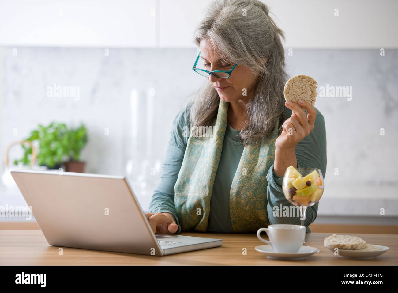 Mature woman with laptop computer Stock Photo - Alamy