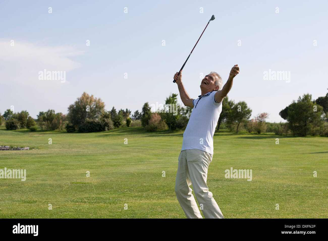Mature man playing golf Stock Photo - Alamy