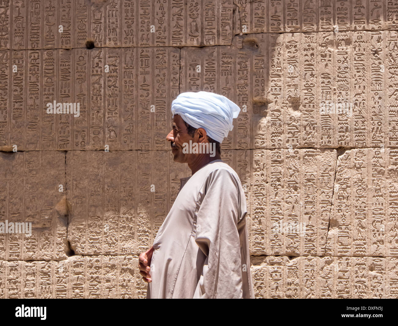 an Egyptian man wearing a Gallibaya and Turban at the temple of Hathor ...