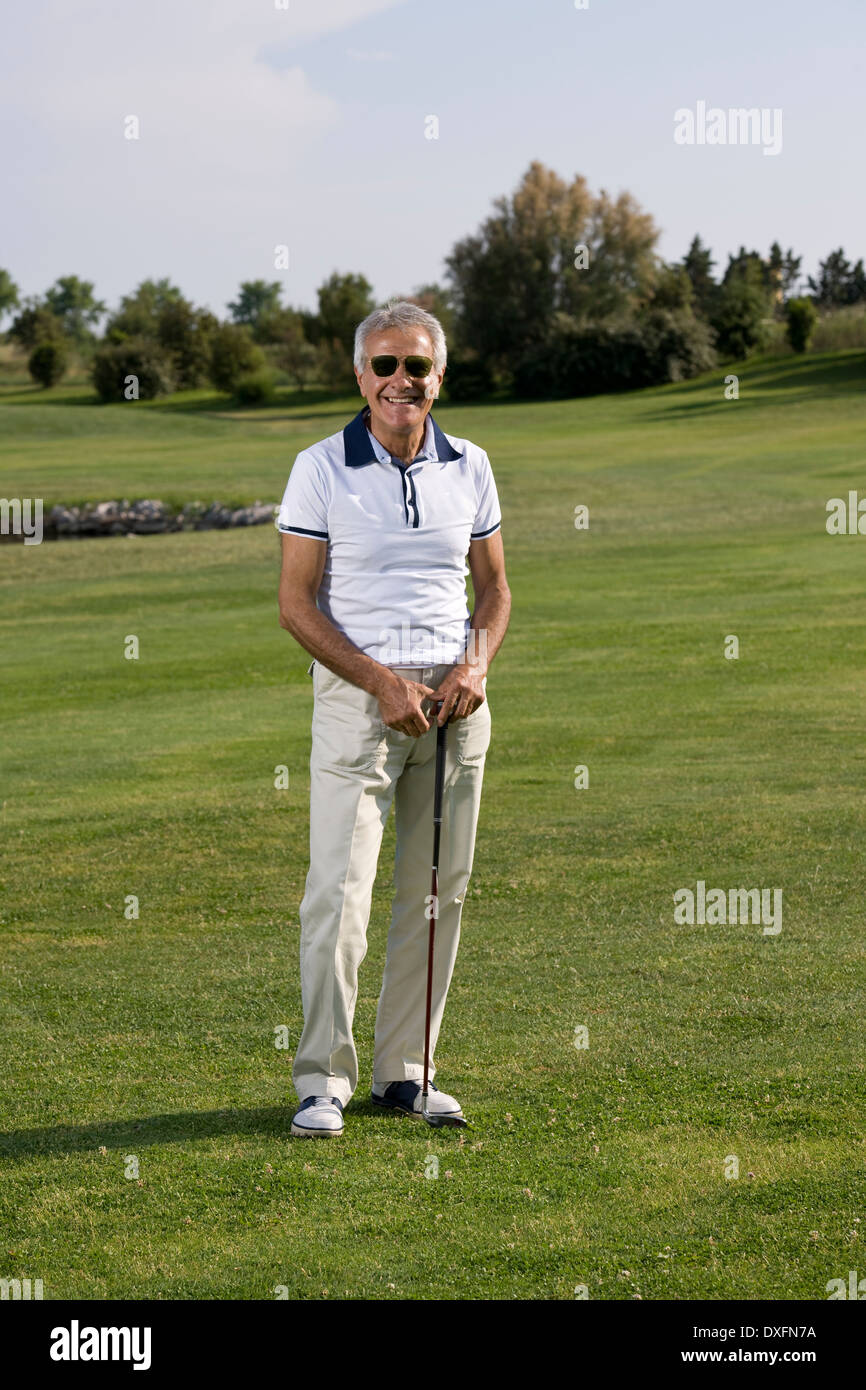 Mature man playing golf Stock Photo - Alamy