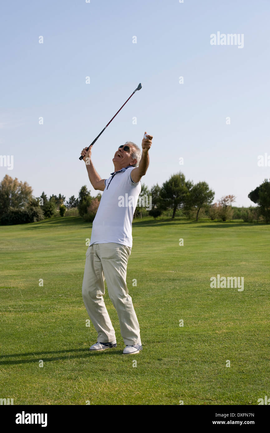 Mature man playing golf Stock Photo - Alamy