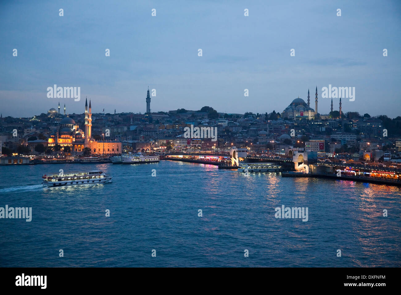 New Mosque,ferry and Galata Bridge at night in Istanbul,Turkey Stock ...