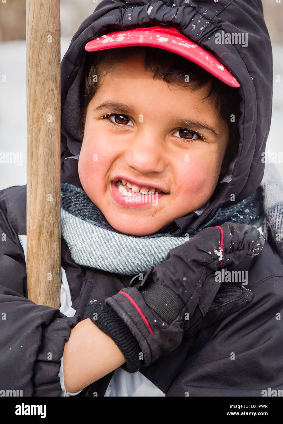 Young boy playing outdoors in cold weather Stock Photo - Alamy