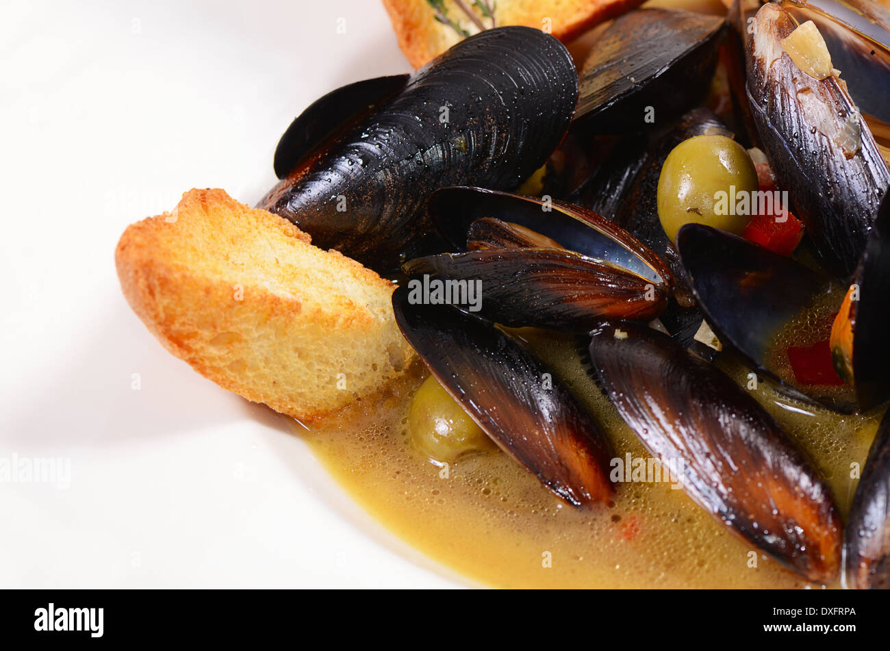Mussels Tuscan with crispy ciabatta close up Stock Photo - Alamy