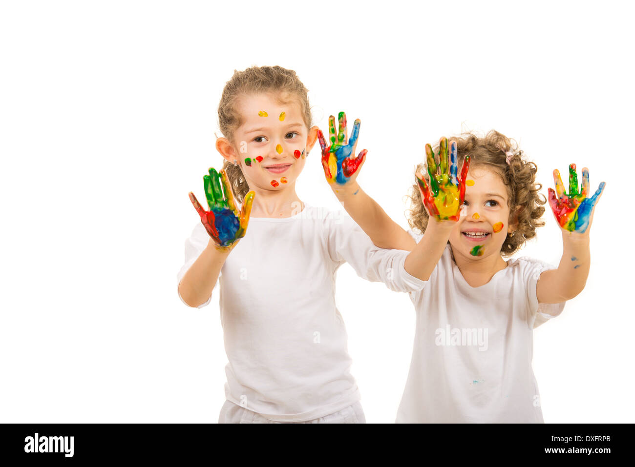 Two girls showing colorful hands isolated on white background Stock ...