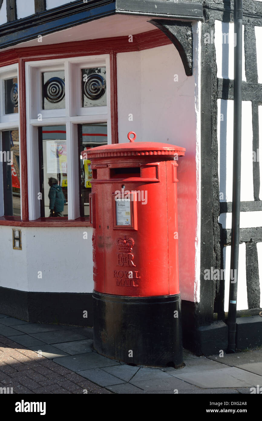 English Post Box with timbered Building Stock Photo - Alamy