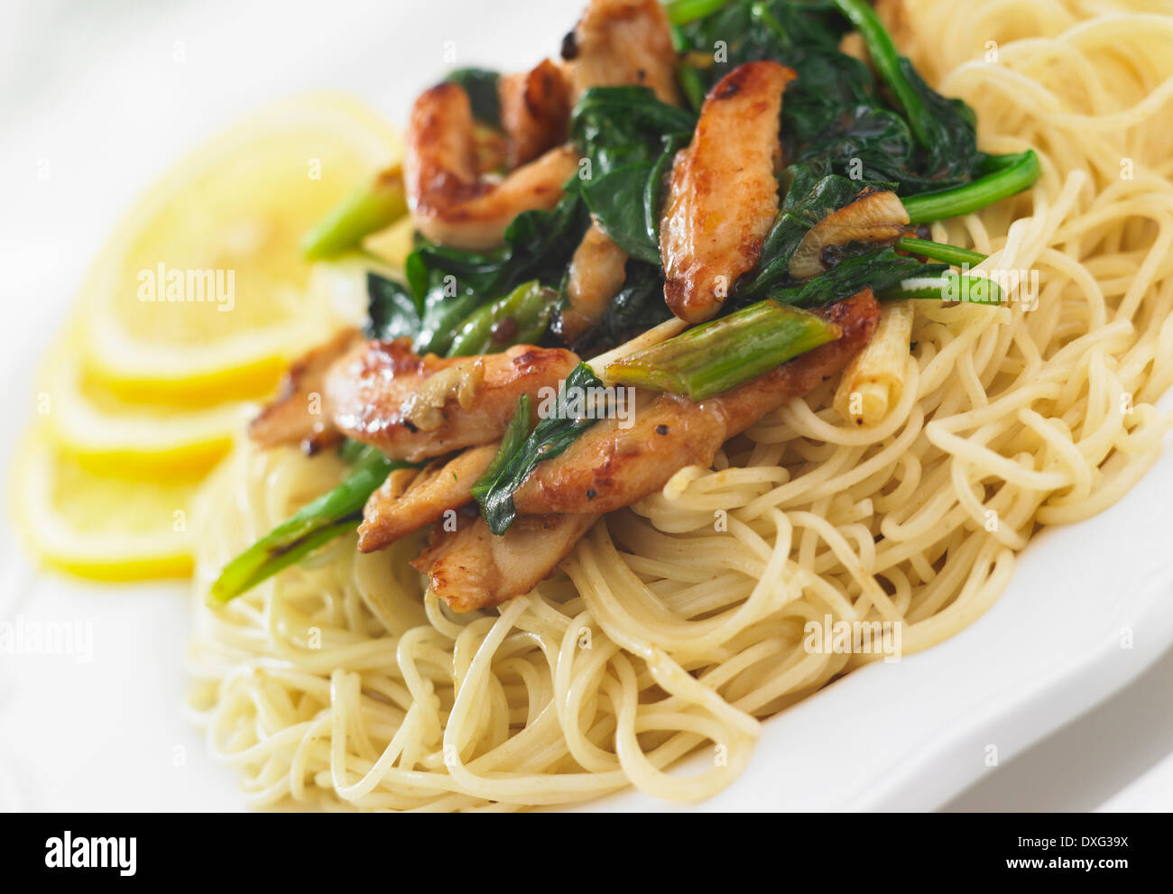 Spagettini With Stir Fried Lemon Chicken Stock Photo - Alamy