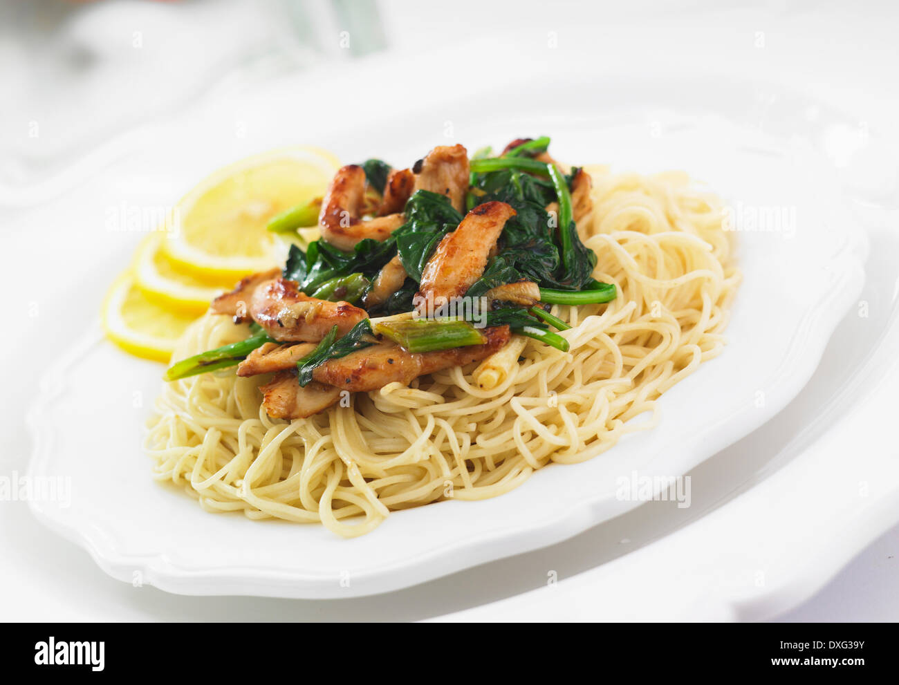 Spagettini With Stir Fried Lemon Chicken Stock Photo - Alamy