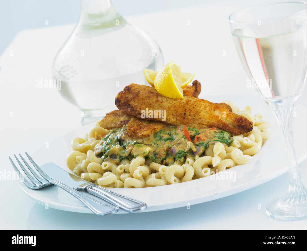 Pasta Twists With Curried Spinach And Fish Stock Photo - Alamy