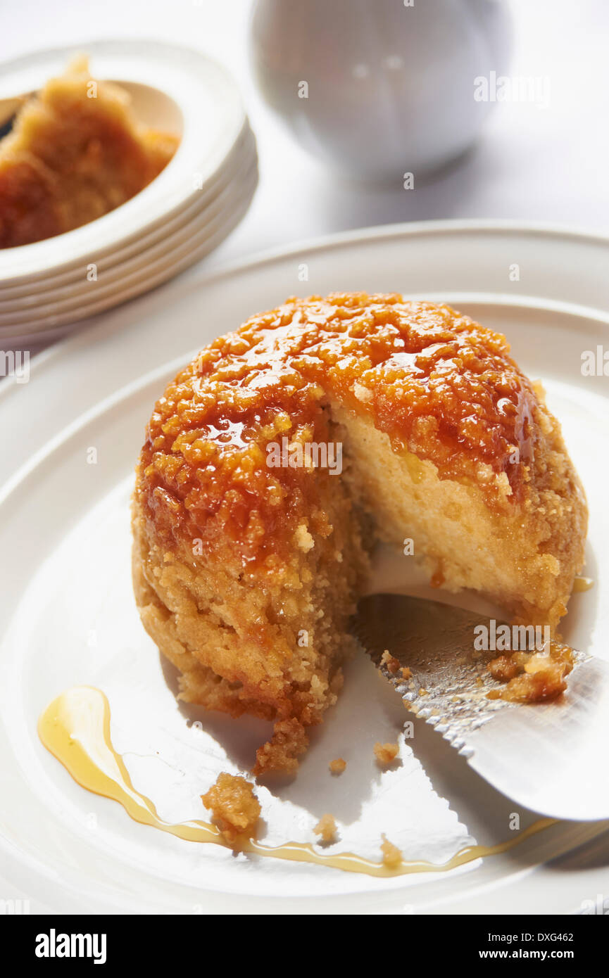 Bowl Of Steamed Syrup Pudding With Jug Of Custard Stock Photo - Alamy