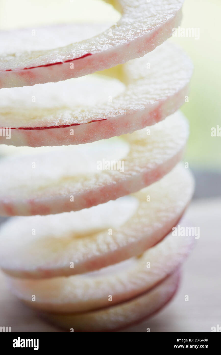 Peeled And Sliced Red Devil Apple On Wood Stock Photo - Alamy