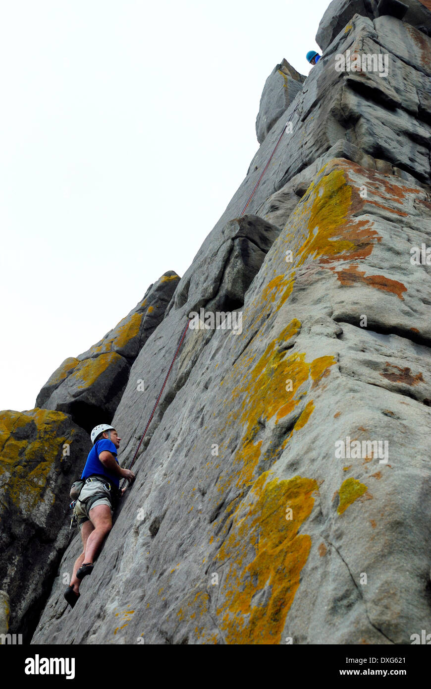 Rock climber on sea cliffs at Morgan Bay, Eastern Cape, South Africa ...