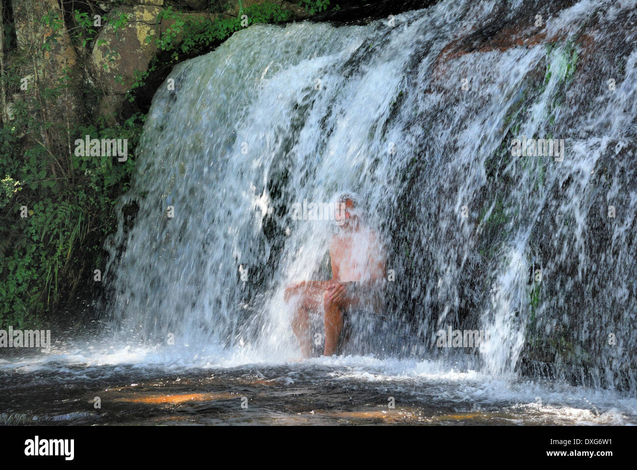 Bather in waterfall, upper Tyume River, Hogsback, Eastern Cape, South ...