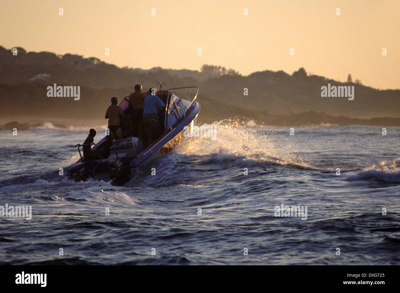 Early morning speed boat launching through the breakers Stock Photo - Alamy