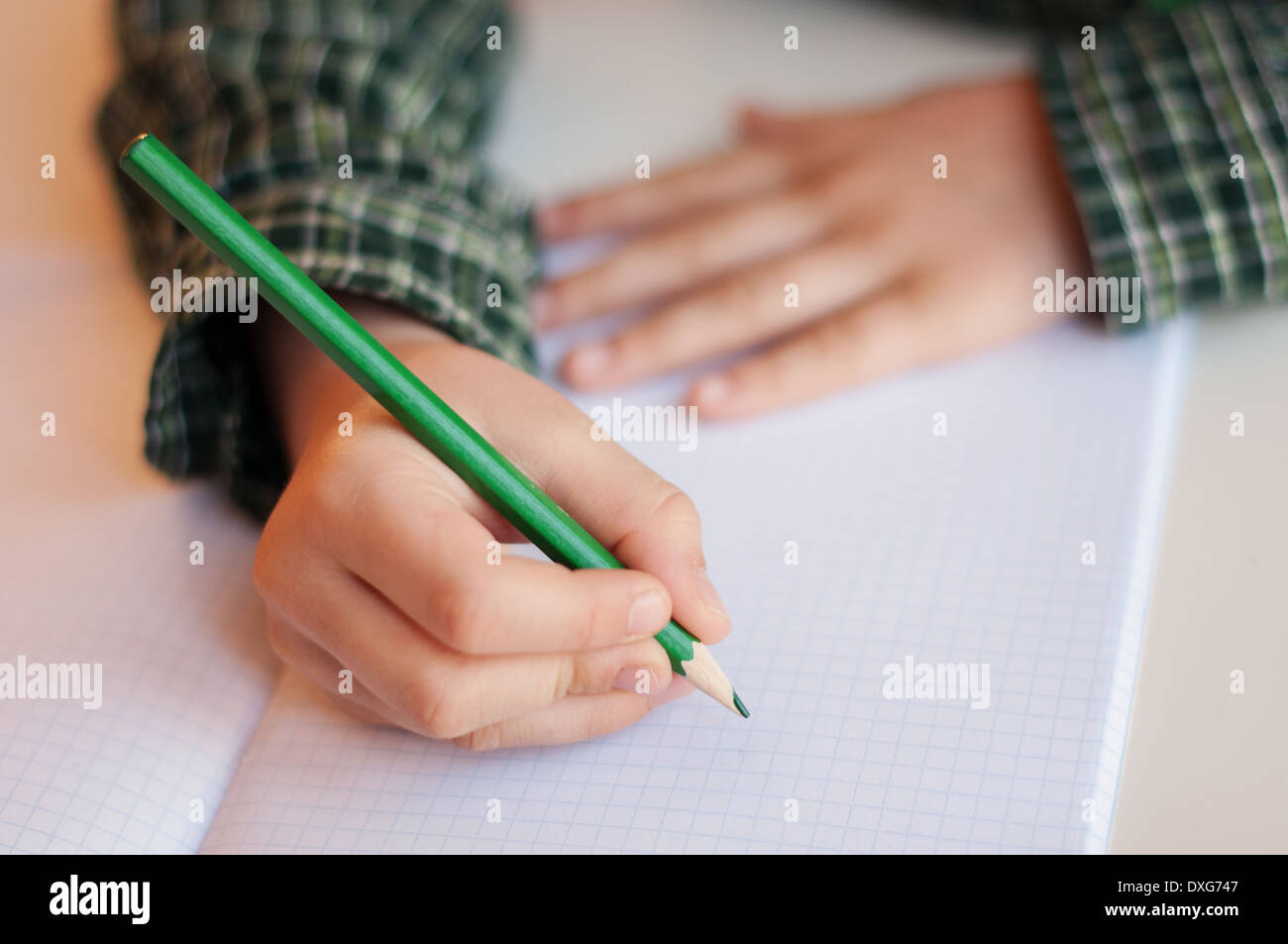 Student hand with pencil on desk hi-res stock photography and images ...
