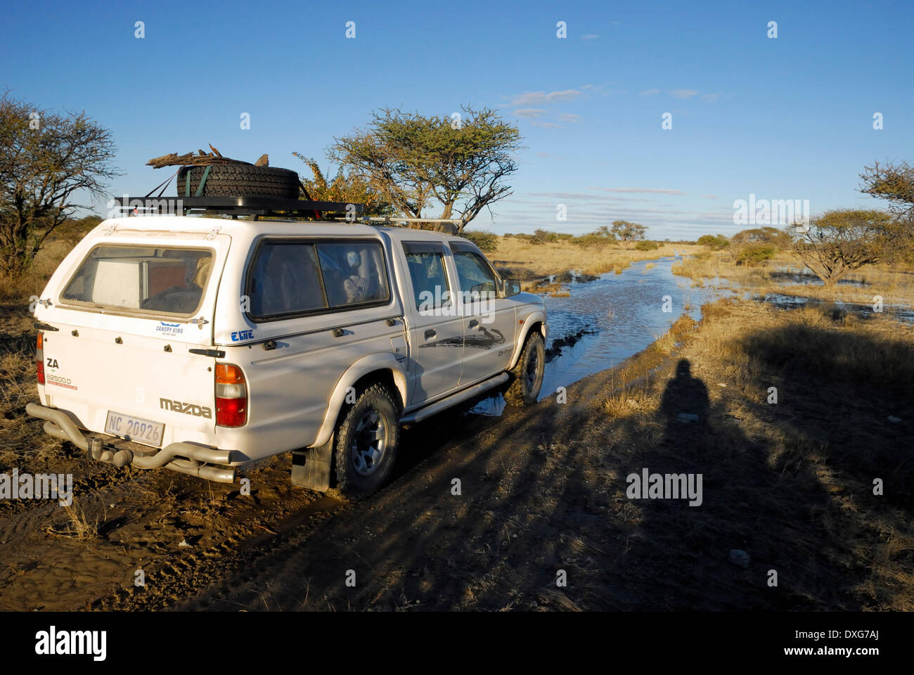 Driving on the flooded track to Kubu Island on the edge of Sowa Pan ...