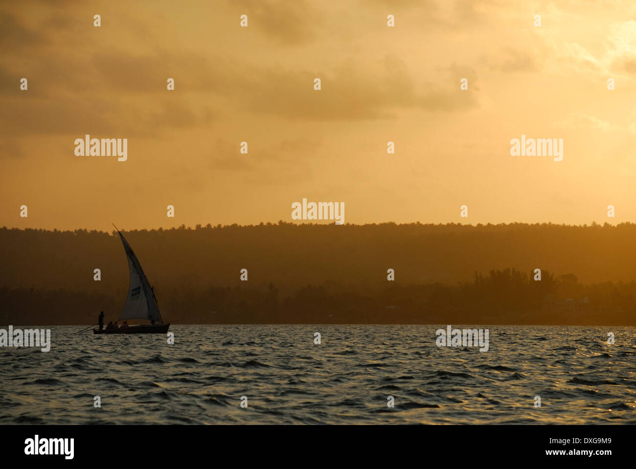 Dhow with passengers sailing in Inhambane bay at sunset Stock Photo - Alamy