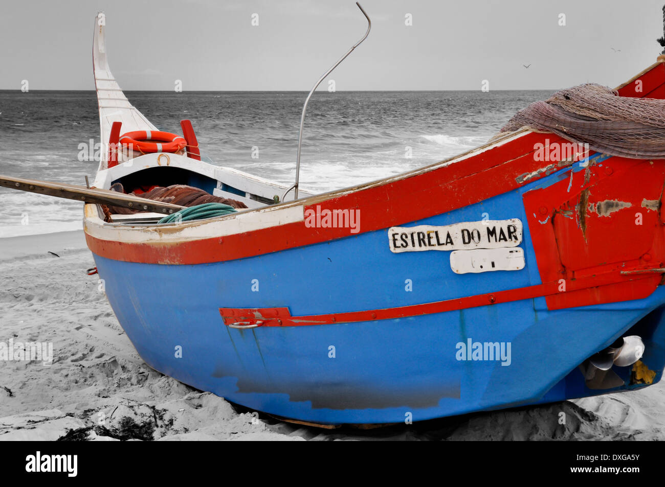 Old rowboat on the beach Stock Photo - Alamy