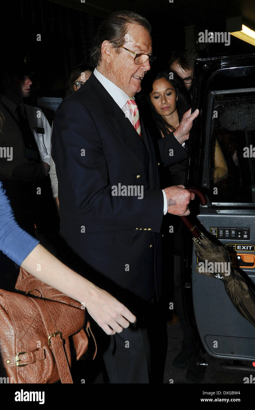 Sir Roger Moore leaving Harrods in Knightsbridge with his wife London ...