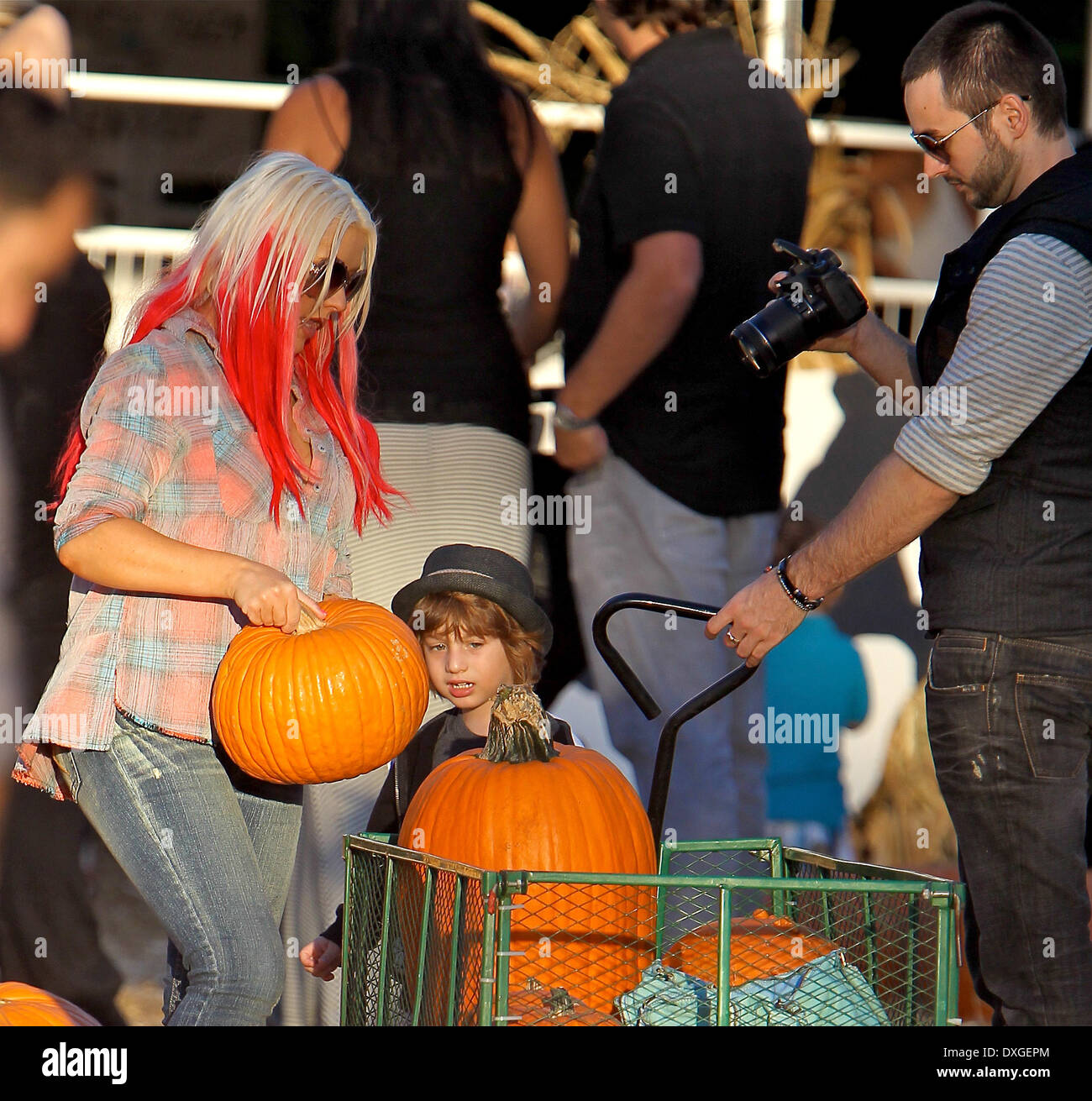 Christina Aguilera, Matthew Rutler taking a photo, and Max Bratman Christina Aguilera enjoys a ...