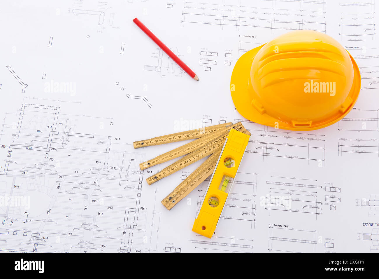 Hard hat and tools on a blueprint Stock Photo - Alamy