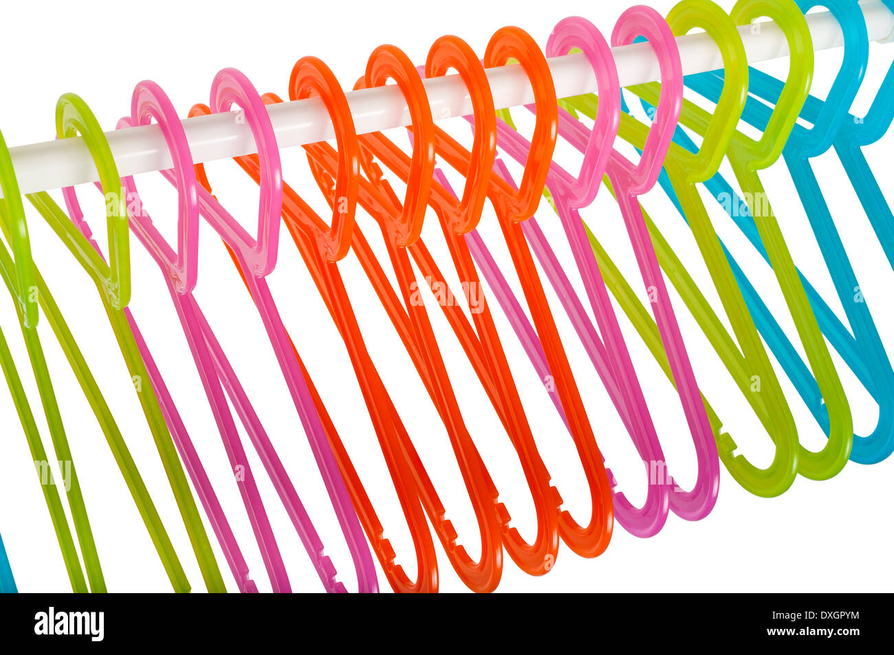 Colored plastic hangers hanging on a rod isolated on white background ...