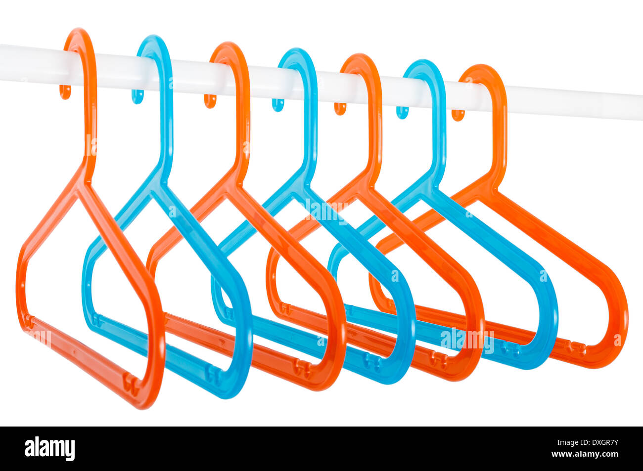 Colored plastic hangers hanging on a rod isolated on white background ...