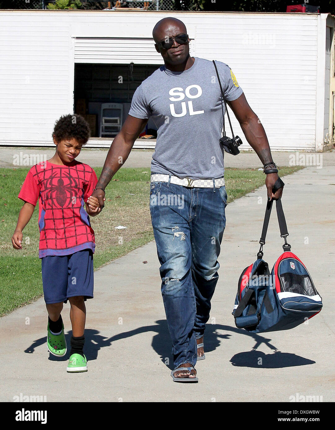Henry Samuel and Seal Seal arrives at his son's soccer game at a park ...