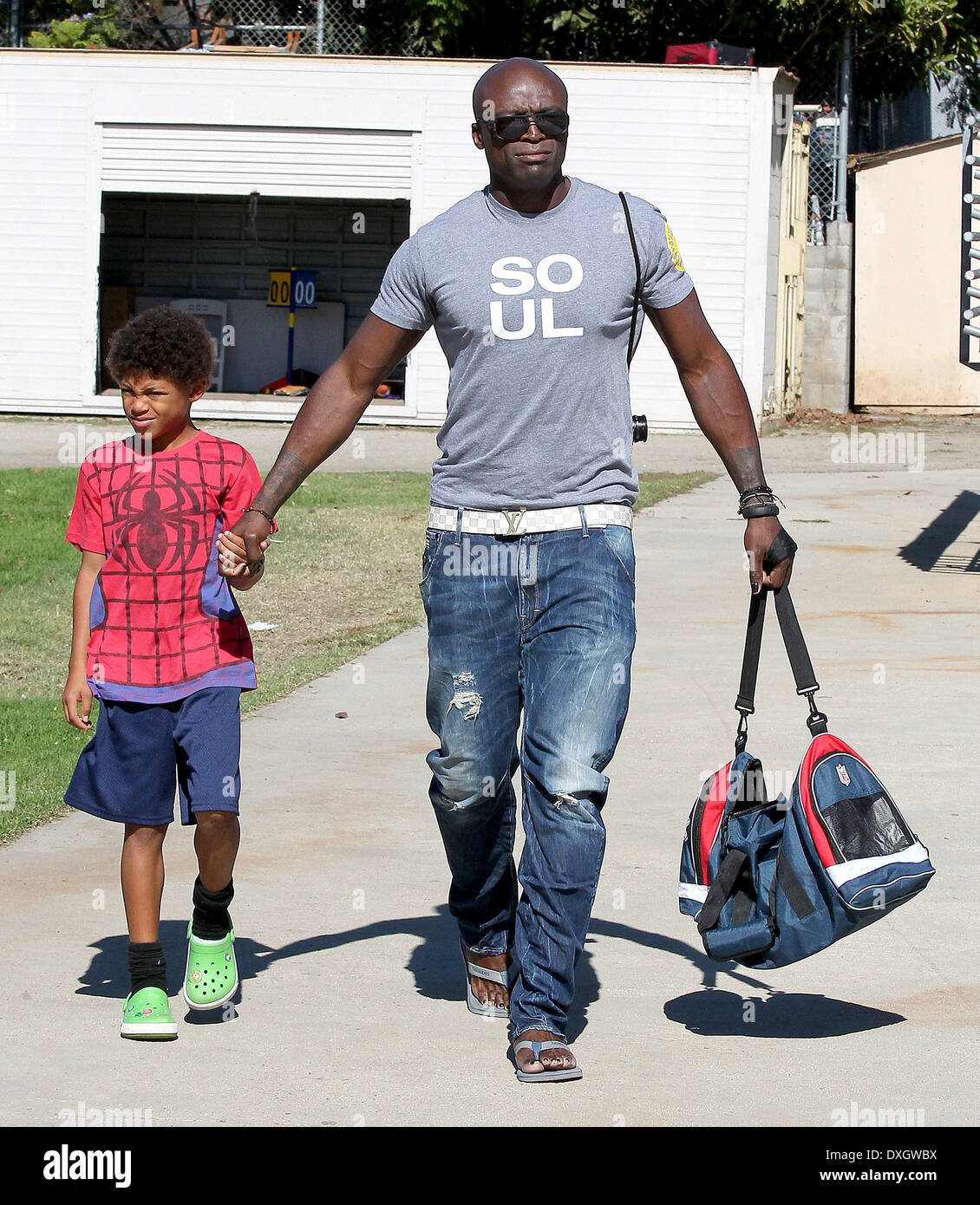 Henry Samuel and Seal Seal arrives at his son's soccer game at a park ...